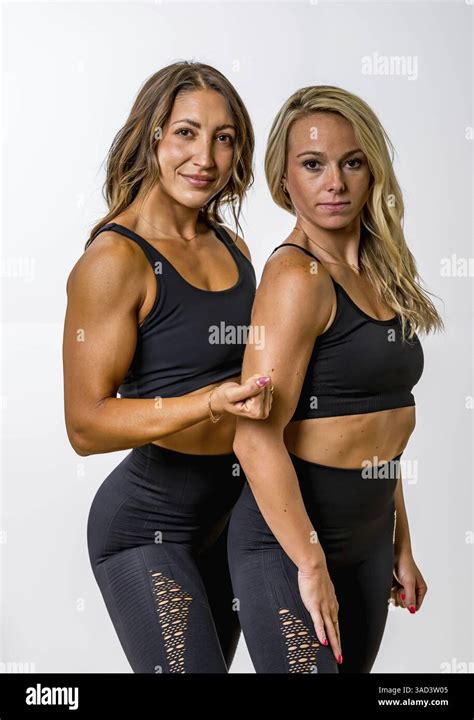 Two Gorgeous Athletic Fit Models Pose Confidently Their Toned Muscles Highlighted By Soft