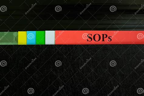 Hand Picking Sop File Record In Black Binder Folder Standard Operating