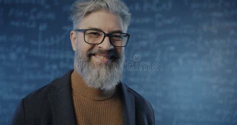 Slow Motion Portrait Of Cheerful Middle Aged Man Wearing Suit And Glasses Standing In Class With