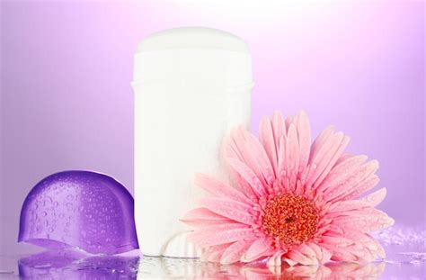 Premium Photo Deodorant With Flower On Purple Background