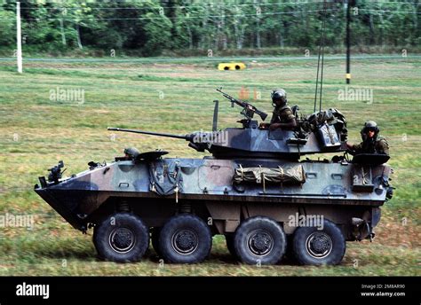 A Marine Lav 25 Light Armored Vehicle Lav Crosses A Field To Reach A