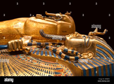 Side Close Up View Of Golden Funerary Mask Of Tutankhamun With Crossed Crook And Flail Detailed