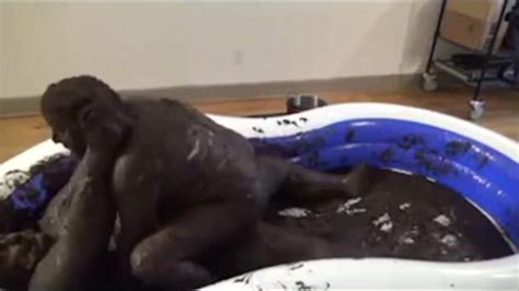 Couple Playing In Cow Shit