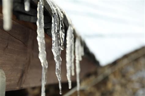 Premium Photo Icicle Hanging From The Roof Close Up And Selective Focus