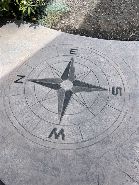 Compass Stamp With Custom Stain2 Palermo Concrete Inc