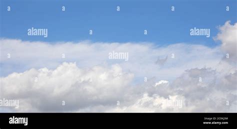 Blue Sky With Different Clouds Ideal As A Horizontal Background Stock