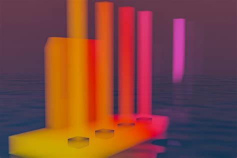 A Group Of Colorful Objects Floating On Top Of A Body Of Water Photo