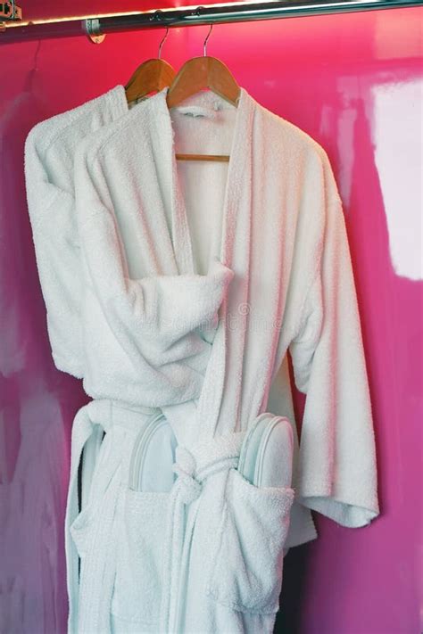 White Bathrobe Hanging On Rack Hotel Dressing Gowns On The Door Hanger