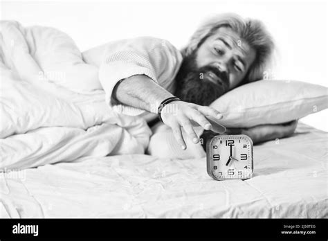 Mature Man Turn Off Alarm Clock Digital Alarm Clock In Bedroom Time To Wake Up Exhausted Man
