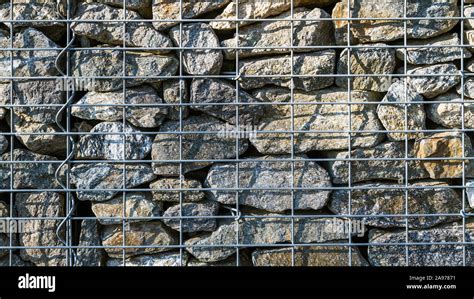 Retaining Wall Made With Wire Fence Stone Wall In Wire Mesh Hi Res