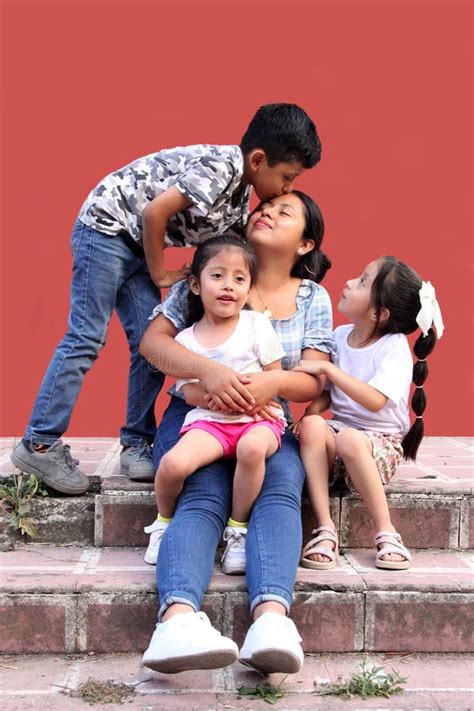 Latina Mom With 2 Daughters And A Son Show Their Love With Kisses And Hugs To Celebrate Mother S