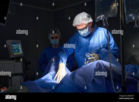 Doctors Performing Gynecological Operation At The Hospital With