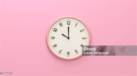 Closeup Pink Wall Clock Set On Pastel Pink Background Stock