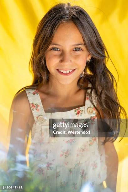 Happy Cute Girl With Long Brown Hair Wearing Floral Dress High Res