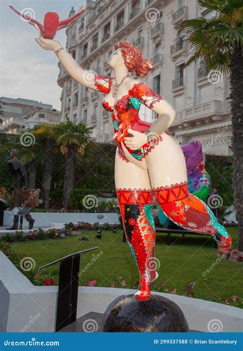 Public Art Sculpture Of Scantily Clad Woman Standing On One Leg