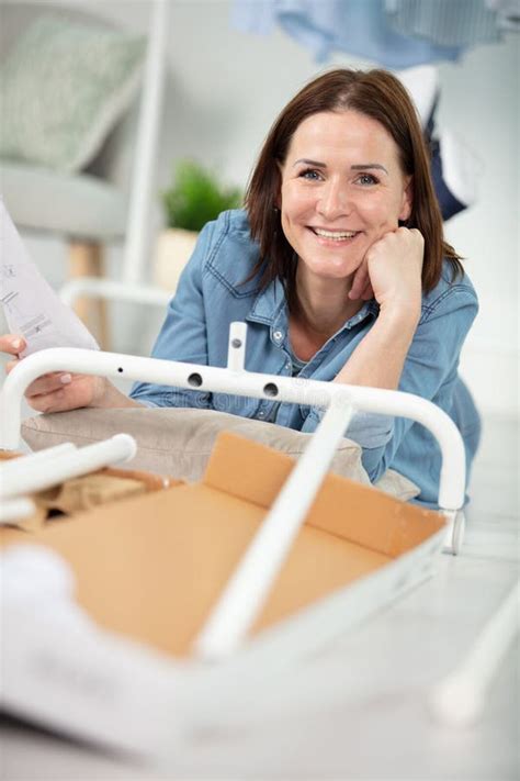 Happy Woman With Self Assembly Furniture In Kitchen Stock Image Image