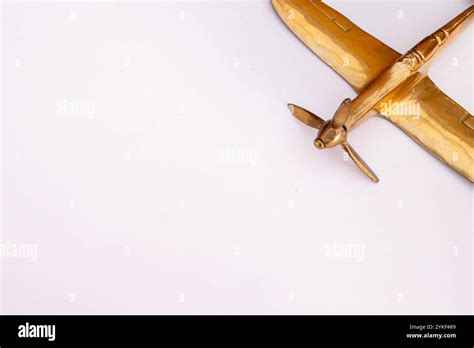 Vintage Wwii Brass Airplane Spitfire Model On White Background Historic Military Aviation