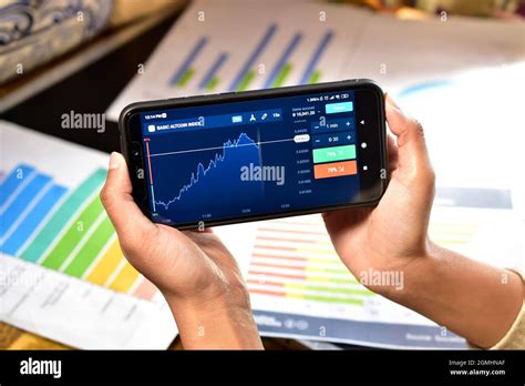 Trading And Analyzing Chart On Smartphone Stock Photo Alamy