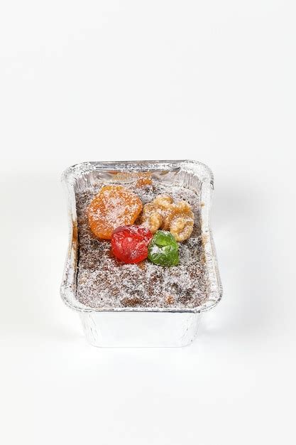 Premium Photo Small Fruit Cake In Foil
