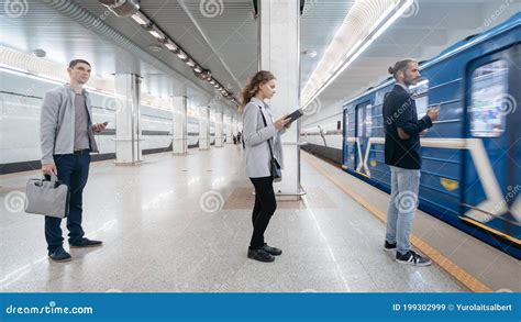 Subway Passengers Waiting For The Train On The Platform Stock Image