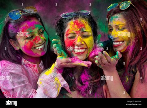 Three Indian Teenage Girls Playing Holi During Holi Color Festival