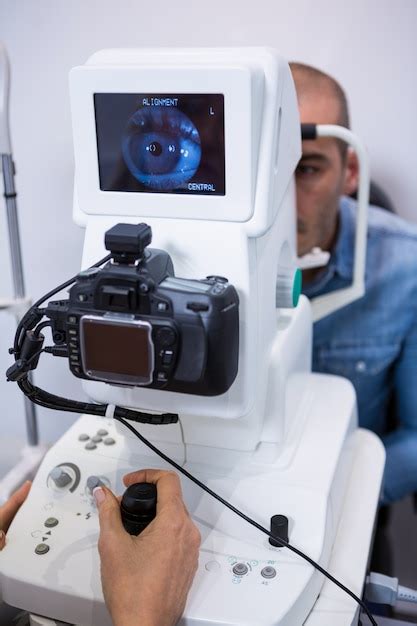 Premium Photo Man Looking At Eye Test Machine