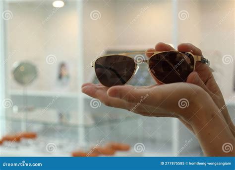 Hand Holding Glasses In Eyeglasses Shop Glasses In Female Hand Stock