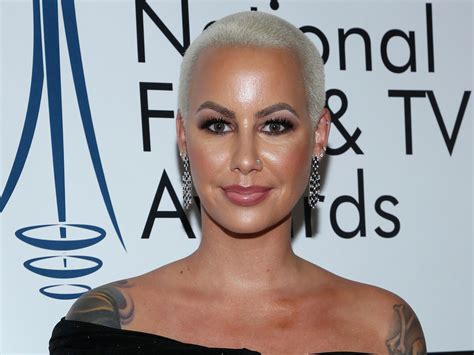 Amber Rose Cross Face Tattoo