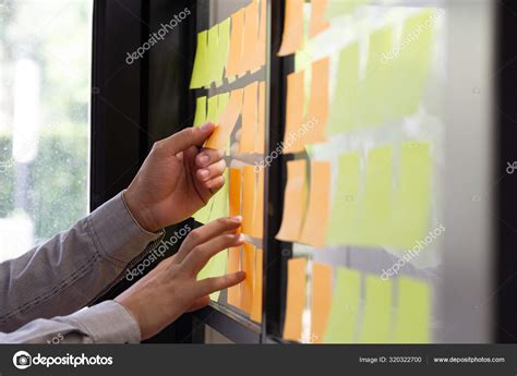 It Worker Tracking His Tasks On Kanban Board Using Task Control Of