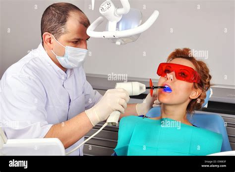 Girl Teeth Stopping Treatment With Dental Curing Ultraviolet Light
