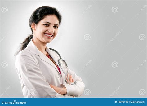 Indian Doctor Seeing Patients In Office Doctor Is Examining Daughter Stock Image