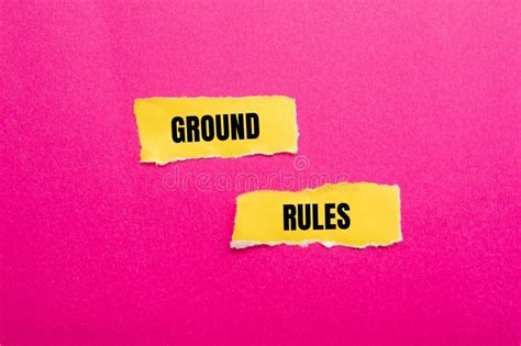 Ground Rules Message Written On Ripped Yellow Paper Pieces With Pink