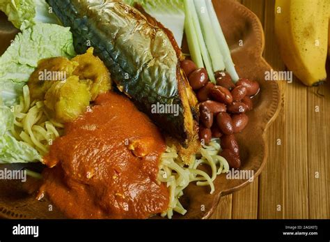 Kenkey With Fried Fish And Chili Pepper Ghanaian Cuisine Traditional
