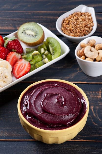 Premium Photo Brazilian Frozen Açaí­ In A Bowl Accompanied By Tropical Fruits Fruit Of The Amazon
