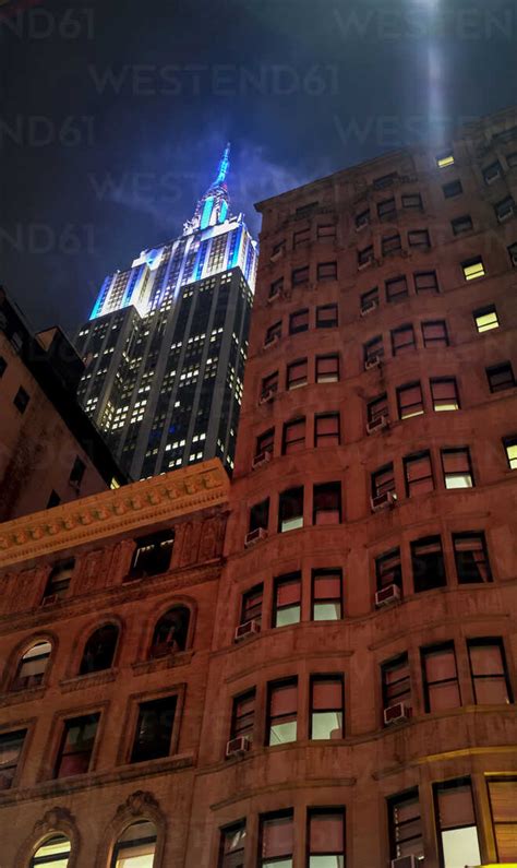 Usa New York High Rise Buildings And Empire State Building At Night