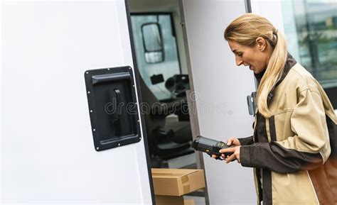 Delivery Agent Holding Barcode Scanner Outside Her Van To Check Parcels Stock Image Image Of