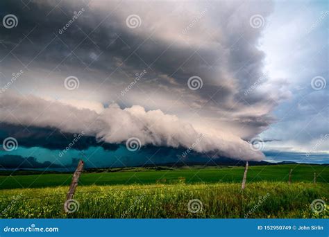 Storm Clouds Over A Green Grass Field Stock Image Image Of Black