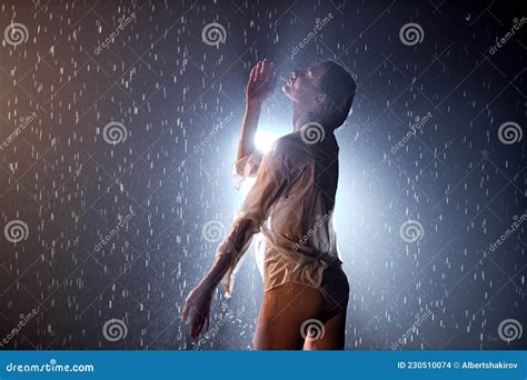 Seductive Caucasian Woman In Candid Lingerie Posing Under Rain Water