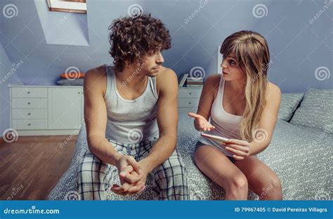 Young Couple With Pregnancy Test In A Discussion Stock Image Image Of