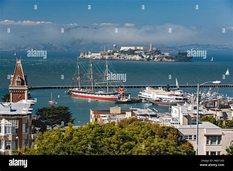 Alcatraz Island And Balclutha Ship Located In San Francisco Maritime