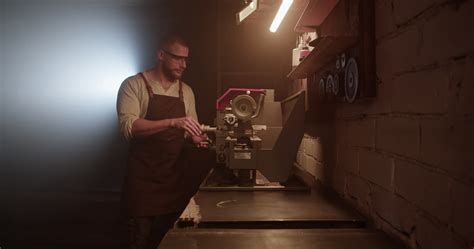 Male Worker Operating Lathe Machine In Dark Garage 36027106 Stock Video At Vecteezy Male Worker Operating Lathe Machine In Dark Garage 36027106 Stock Video At Vecteezy