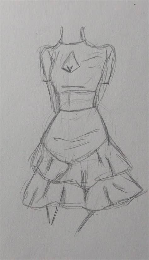 A Drawing Of A Dress On A White Paper