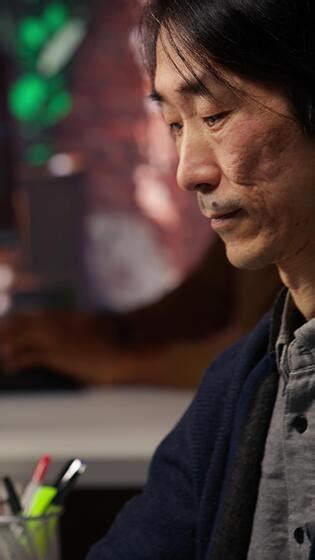 Vertical Senior Programmer In Ai Startup Office Putting On Headphones