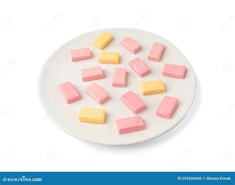 Pile Of Chewable Vitamins On A Yellow Table Royalty Free Stock