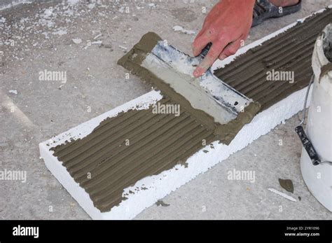 Contractor Insulating House Foundation With Styrofoam Insulation Sheets