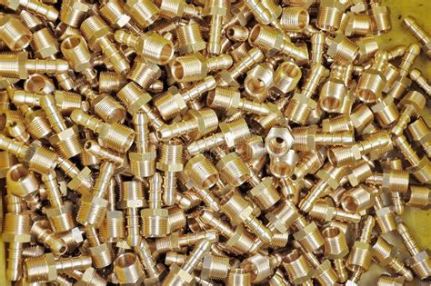 Background Of Brass Fittings Machined With Cnc Lathe Stock Image
