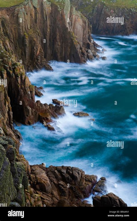 Atlantic Ocean Waves Crash Around The Base Cliffs Lands End Uk Stock