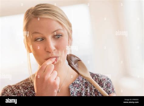Woman Chocolate Spoon Licking Hi Res Stock Photography And Images Alamy