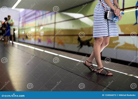 Young Woman Standing On Subway Station And Waiting For The Train Stock