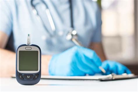 Diabetes Concept Doctor Shows Glucometer With Glucose Level Stock
